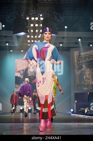 Female models walk down the catwalk in the Suzuki Fashion Theatre ...