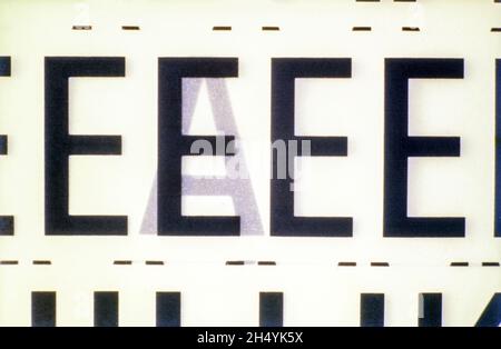 Graphic designer using Letraset, dry transfer lettering system in the ...