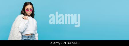 preteen girl holding pink sunglasses isolated on blue, banner Stock ...