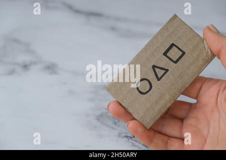 Kiev Ukraine - October 2021 Hand holding a squid game invitation card ...