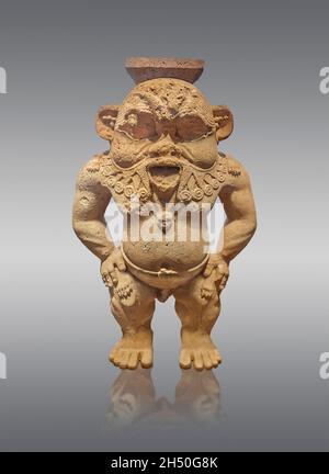 This ancient Egyptian sculpture of the god Bes depicts him standing on ...