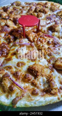 Closeup shot of a cheesy pizza in a bo Stock Photo - Alamy