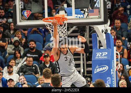 San Antonio Spurs forward Keldon Johnson drives between Oklahoma City ...