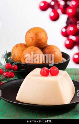 Buñuelos and natilla, delicious Colombian combination Stock Photo - Alamy