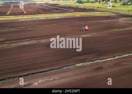 Peat Harvester Tractor on Collecting Extracting Peat. Mining and ...