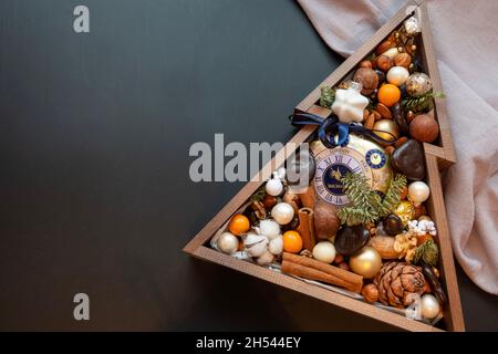 Snow fir tree, photo frames and christmas decor on rope over rustic ...