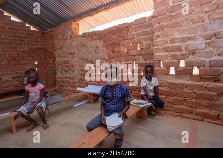 primary students studying brick and wood material in classroom Stock ...