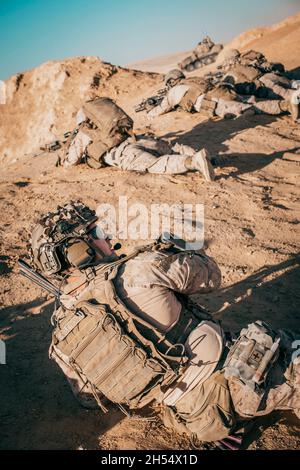 U.S. Marines take cover behind a wall during a training evolution Stock ...