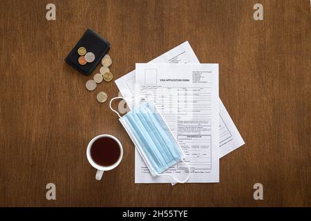 Visa application form on a wooden table, visa processing, registration ...