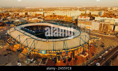 KHARKIV, UKRAINE - OCTOBER 22, 2021: Metalist stadium in sunset lights ...