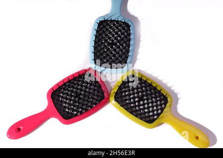 Bright multi-colored hair comb on a white background Stock Photo - Alamy