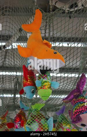 Colorful stuffed Animal prizes hanging in fair game booth Stock Photo ...