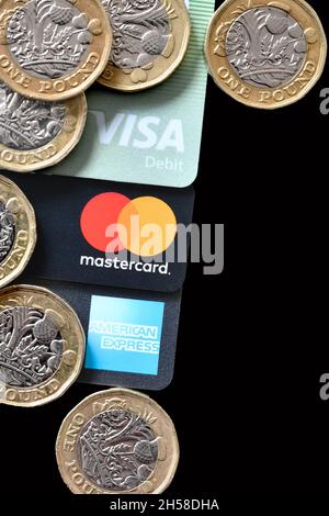 top view of credit cards, coins, cheque on wooden table Stock Photo - Alamy