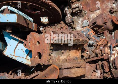 Piles of scrap internal combustion engines stacked in a scrap yard ...