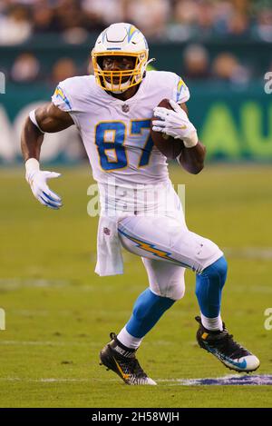 Los Angeles Chargers tight end Stone Smartt, top, is tackled by Miami ...