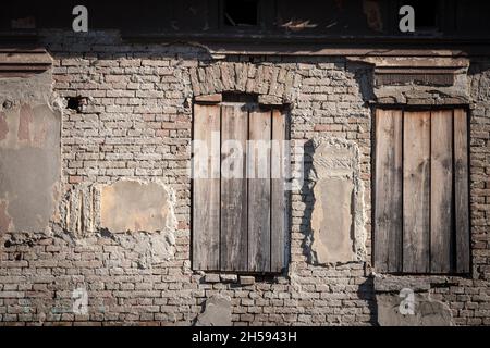 Picture of facades with boarded windows, ready for destruction and ...