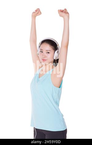 Asian woman stretching arms wearing headphones doing morning exercise ...