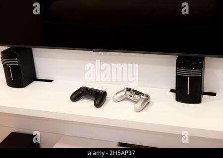 Two joysticks for video games on the nightstand. Modern technologies ...