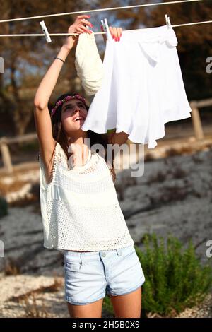 Teen girl doing household chores Stock Photo - Alamy