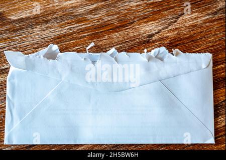 Selective focus on jagged edges of a ripped open mail envelope Stock ...