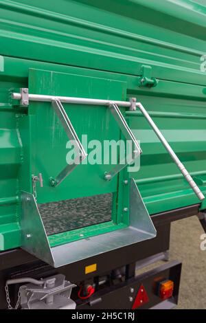 Manual Grain Door Open Gate at Farm Tipping Trailer Stock Photo - Alamy
