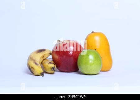 Citrus limetta, apple, banana and mango isolated on white background ...