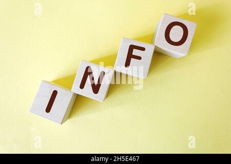 Info word written on wood block. Info text on table, concept Stock ...