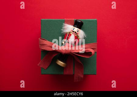 Christmas present box with red ribbon and holiday decorations Stock ...