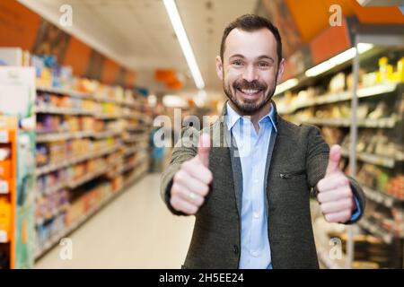 Portrait man who is satisfied of shopping in bike store Stock Photo - Alamy