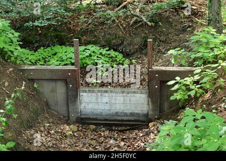 Small gated weir for groundwater infiltration Stock Photo - Alamy