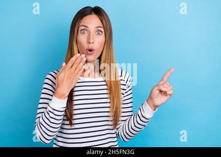 Photo of pretty amazed lady point finger copyspace wear hat white ...