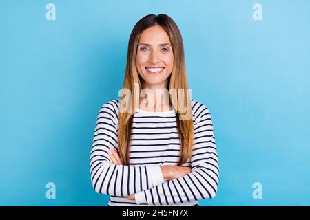 Photo of positive nice girl arms hold demonstrate empty space paper ...