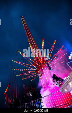 Carousel spinning at high speed, colorful background Stock Photo - Alamy