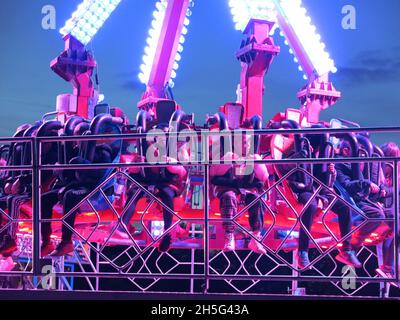 Fairground thrill ride seats and safety harness Stock Photo - Alamy