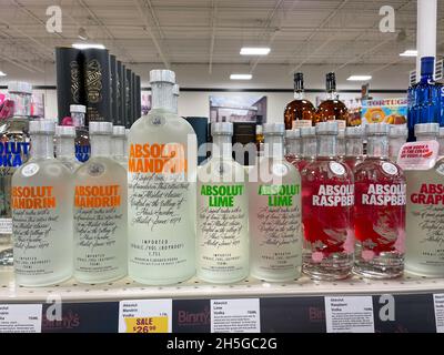 A display of bottles of flavored Absolut Vodka with background bokeh at ...