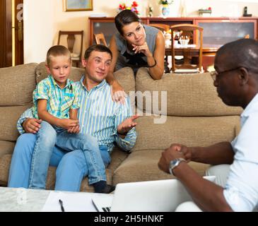Real estate agent portrait with family getting new home. business ...