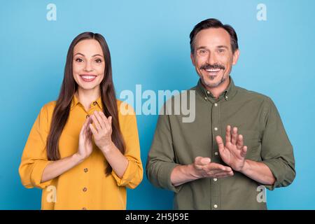 Photo of two positive satisfied partners hands hold bengal light stick ...