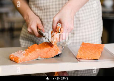a Butchering salmon, piece of salmon red fish meat Stock Photo - Alamy