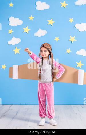 Kid superhero with jetpack. Child pilot play on summer day. Success ...