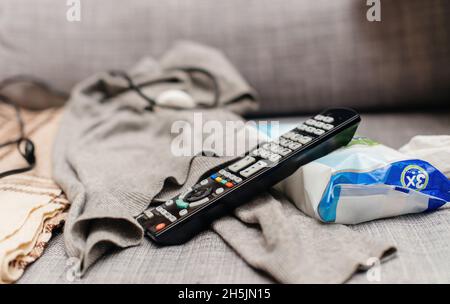 Hygiene at home, clean and disinfect remote control with an ...