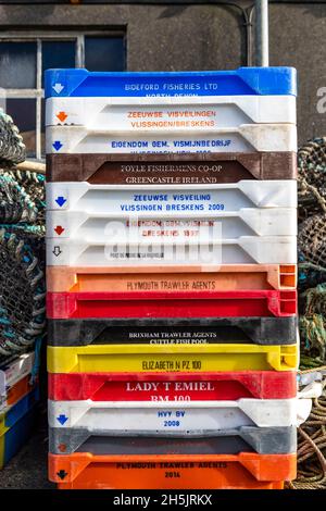 fish boxes stacked in newlyn harbour Stock Photo - Alamy