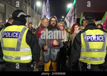 Climate protesters hold a candle lit protest outside the Scottish Event ...
