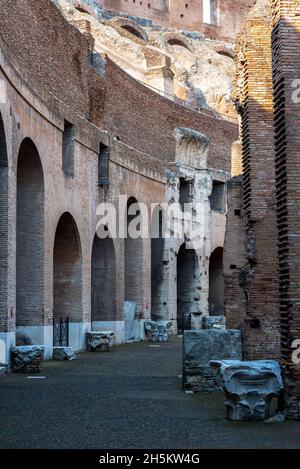 Interior of the Colosseum or Coliseum with the bricks wall and arches ...