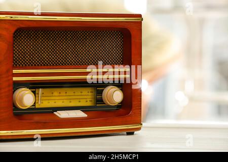 Vintage radio receiver on table in room Stock Photo - Alamy