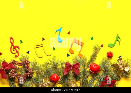 Note signs with Christmas branches and decor on green background Stock ...