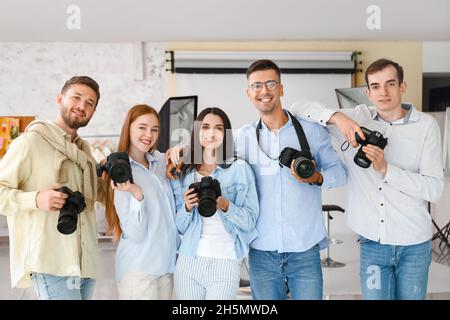 Group of photographers during classes in studio Stock Photo - Alamy