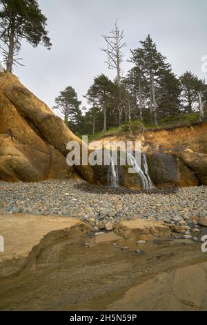 Beach waterfall and caves at Hug Point State Park in Oregon Stock Photo ...