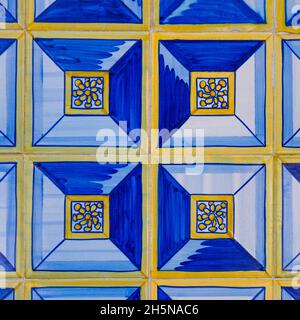 Fragment of building wall with colorful ceramic wall tiles. Azulejos ...