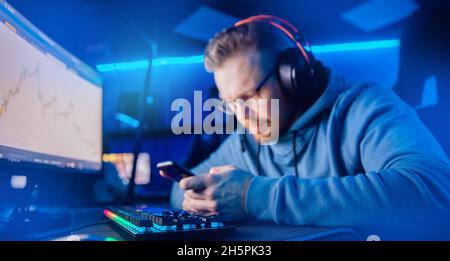 Blured Young male trader stock market broker analysis graphs computer ...