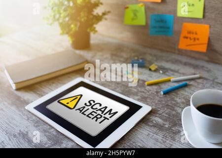 Scam alert detecting warning. Notification on device screen Stock Photo ...